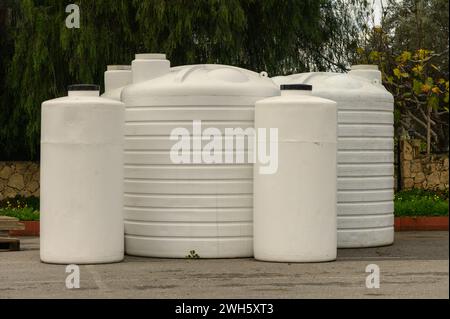 selling water tanks in a village in Cyprus 1 Stock Photo - Alamy