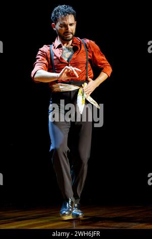 Male flamenco dancer with intense concentration performing elegant hand ...