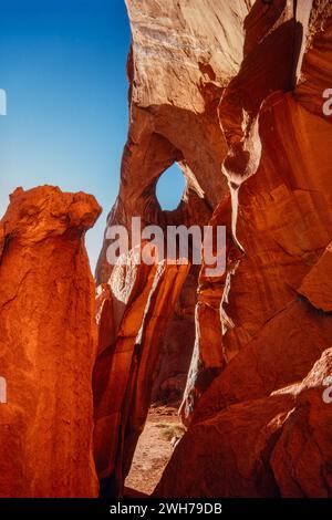 The Eye of the Sun, a natural sandstone arch in the Monument Navajo ...