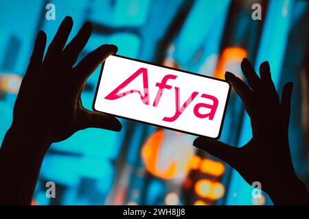 In this photo illustration, the Afya Limited logo is displayed on a ...