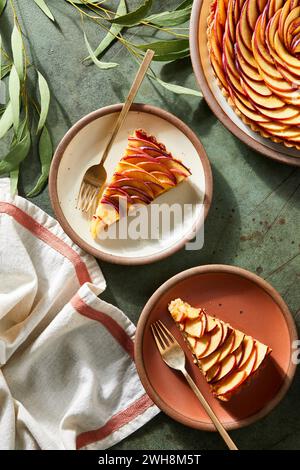 French Apple Tart with layered apples on a green background Stock Photo ...