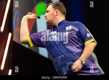 Luke Littler of England throws his dart during the final of the World ...