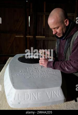 Stonemason Will Davies adds the finishing touches to a memorial stone ...