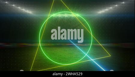 Image of rotating neon shapes and lights over floodlit sports field ...