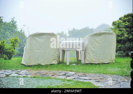 Table and chairs in rain, Elgin Mount Pandim Hotel, Pemayangtse ...