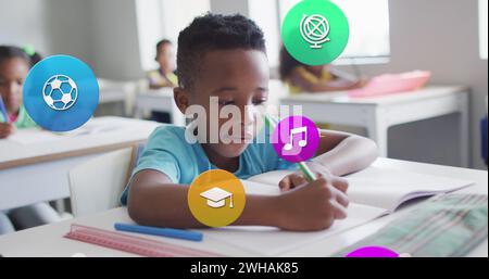 Education and e-learning. Little schoolboy with laptop in classroom ...