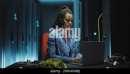 Image of binary coding over african american male it engineer and ...