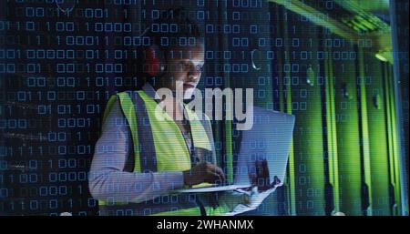 Image of binary coding over african american male it engineer and ...