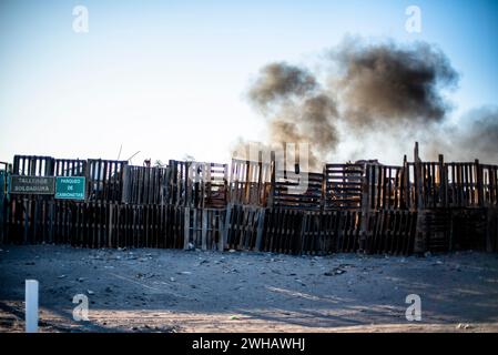 barricade made of old wooden pallets separate the road from accidental ...