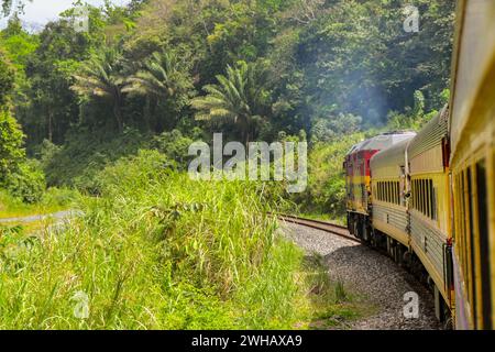 Panama - 22 January 2024: Diesel locomotive pulling coaches rounding a ...