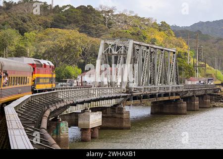 Panama - 22 January 2024: Diesel locomotive pulling coaches rounding a ...