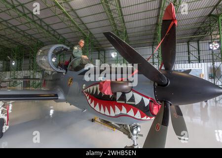 A Dominican Air Force pilot in the cockpit of a Super Tucano fighter ...
