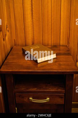 Bible on bed side table Stock Photo - Alamy