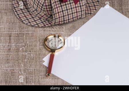 Paper sheets and magnifying glass Stock Photo - Alamy