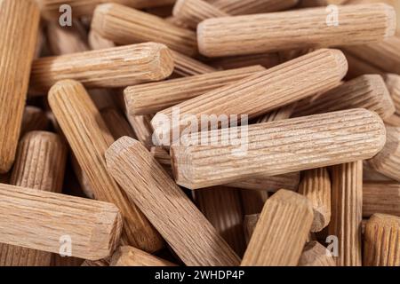Many wooden dowels, various sizes, white background Stock Photo - Alamy