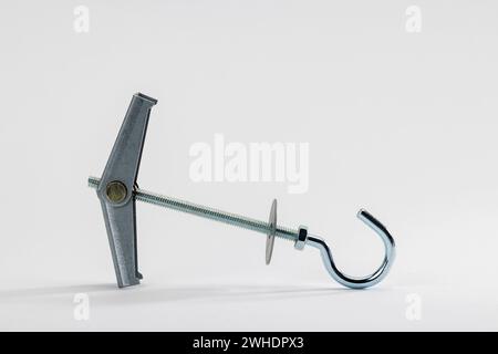 Spring-loaded dowel, cavity dowel, white background Stock Photo - Alamy