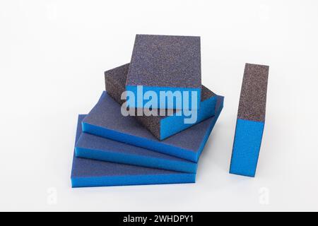 Various sanding sponges, sizes, grits, structures, white background ...