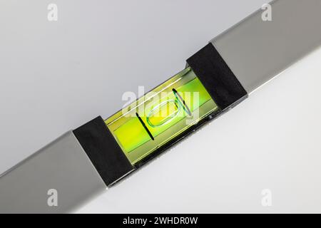 Spirit level, dragonfly, detail, gray, white background Stock Photo - Alamy