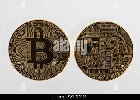 Two Bitcoin coins, front and back, white background Stock Photo - Alamy