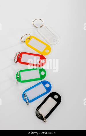 Six plastic key rings with ring, arranged, without lettering, different ...