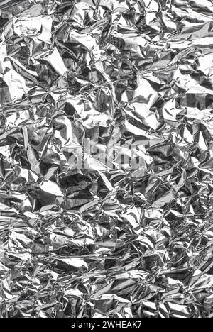 Silver foil texture with crumpled uneven surface Stock Photo - Alamy