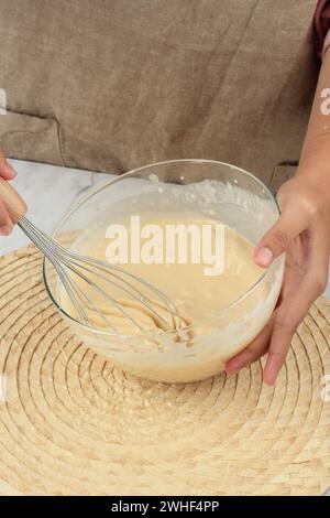 Flat lay. Step by step. Mixing in colorful sprinkles into the cake ...