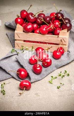 Red ripe cherries in small wooden box Stock Photo - Alamy