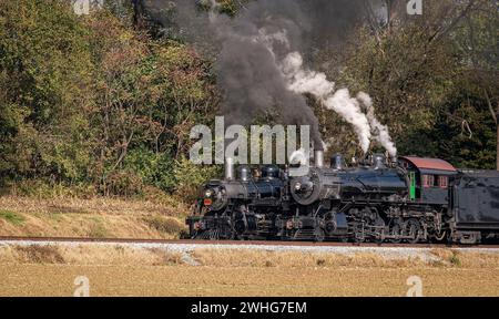 A View of Two Steam Engines, blowing Smoke and Steam Warming Up Next to ...