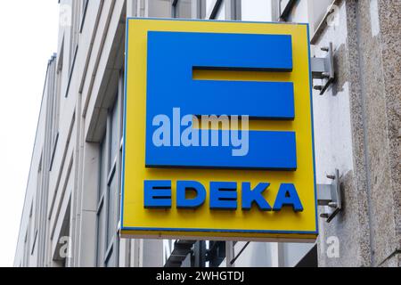 Facade with sing and logo of Edeka Stock Photo - Alamy