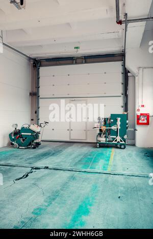 concrete grinding machine in green color inside a warehouse Stock Photo ...