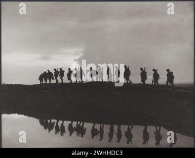 Soldiers silhouetted against the sky marching during the 1917 third ...
