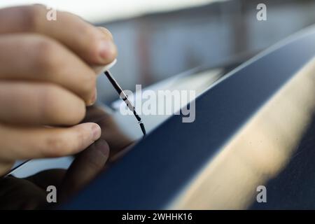 Brush painting small chip scratches car vehicle detailing paint Stock ...