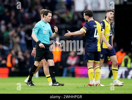 Bournemouth's Lewis Cook speaks with referee Chris Kavanagh after the ...
