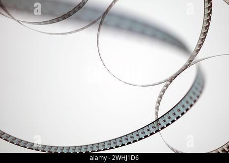 loops of 8mm cine film against a white background Stock Photo - Alamy
