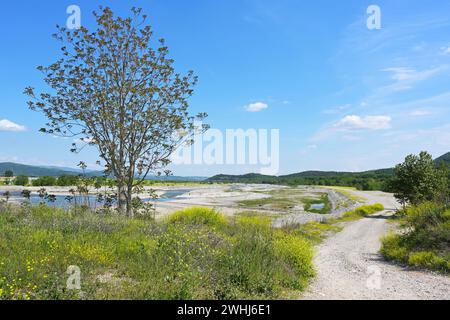 Low water in the riverbed of the Pinios near the mountains of Meteora ...