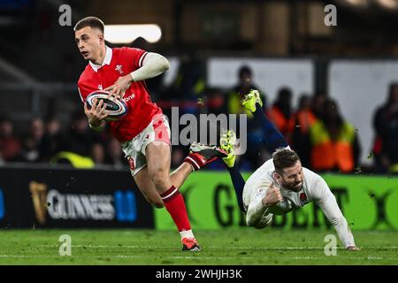 Cameron Winnett of Wales evades the tackle of Elliot Daly of England ...