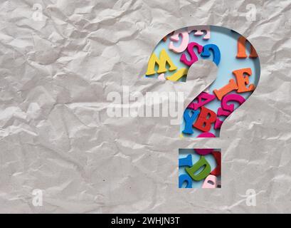 Question mark on crumpled gray paper, wooden letters inside Stock Photo ...