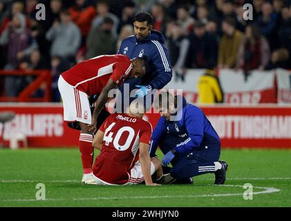 Murillo of Nottingham Forest receives treatment during the Premier ...
