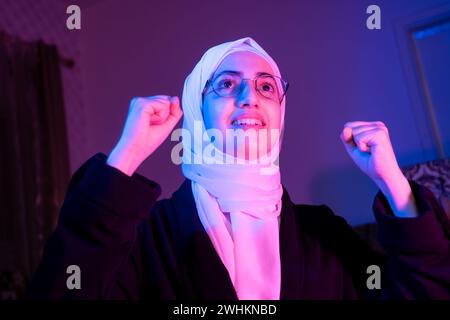 arabic muslim girl playing console games Stock Photo - Alamy