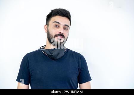 Arabic cheerful man with mask around his neck Stock Photo - Alamy