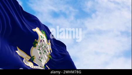Connecticut state flag fluttering in the wind on a clear day. White ...