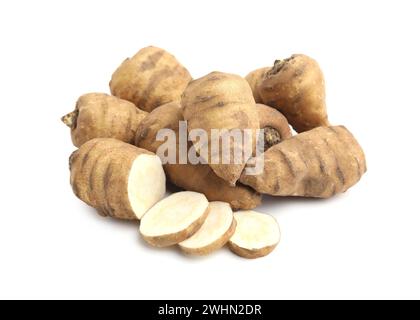 Whole and cut tubers of turnip rooted chervil isolated on white Stock ...