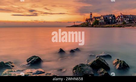 Sunset at the lighthouse and harbor of Urk Holland Netherlands Stock ...