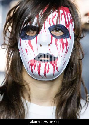 kid wearing scary mask at Halloween party Stock Photo - Alamy