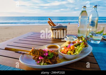 Thai food on a table on the beach in Thailand. table with Thai food ...