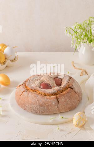 Portuguese traditional Easter cake. Folar with eggs on easter table ...
