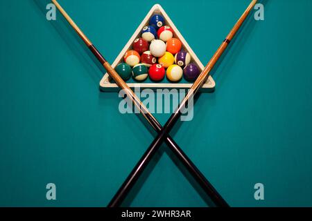 Billiard accessories balls and crossed cues on a billiard table Stock ...