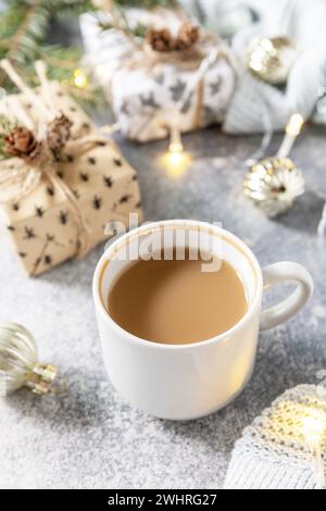 Christmas composition with a cup of coffee on a blurred background ...