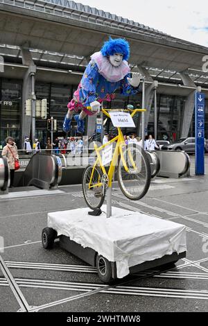 Carnival reveller flying hero on bicycle Stock Photo - Alamy
