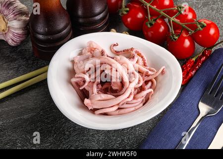Delicous marinated squid tentacles snack in the bowl Stock Photo - Alamy